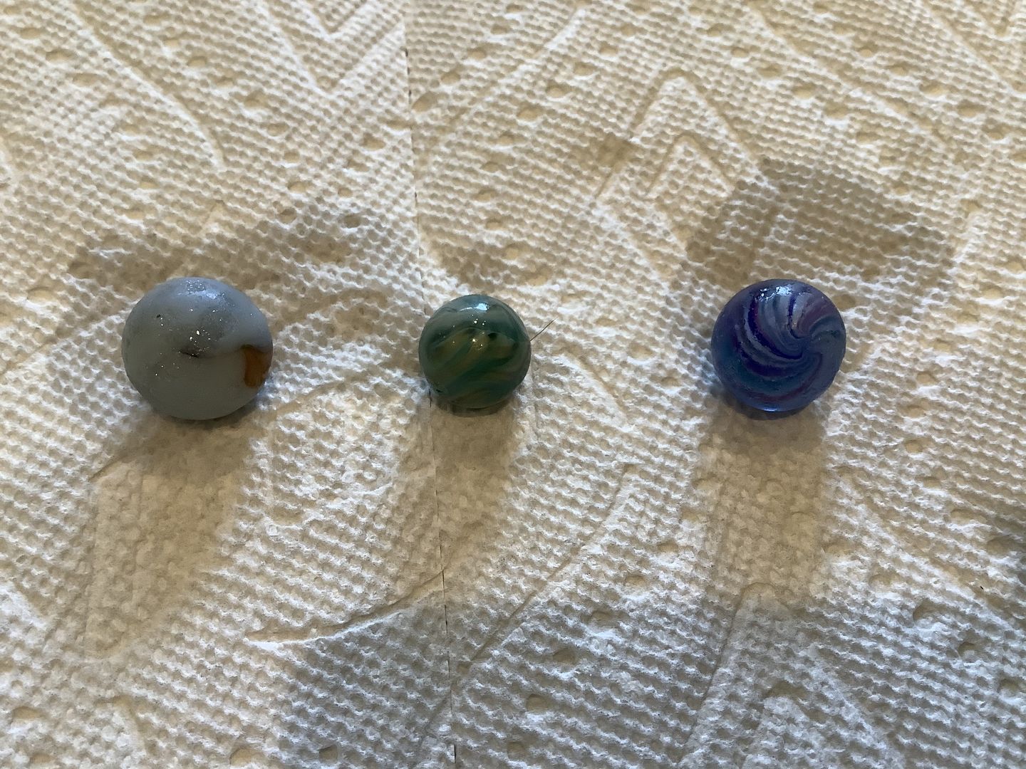 I have a couple boxes of marbles to go thru here is some I need help on ...