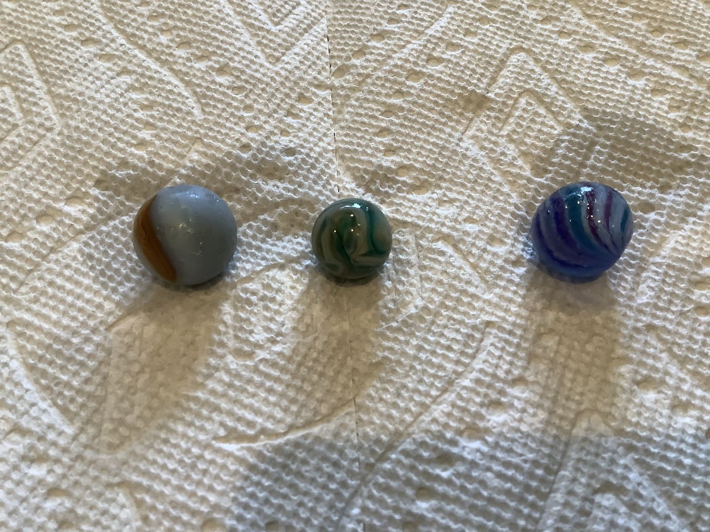 I have a couple boxes of marbles to go thru here is some I need help on ...