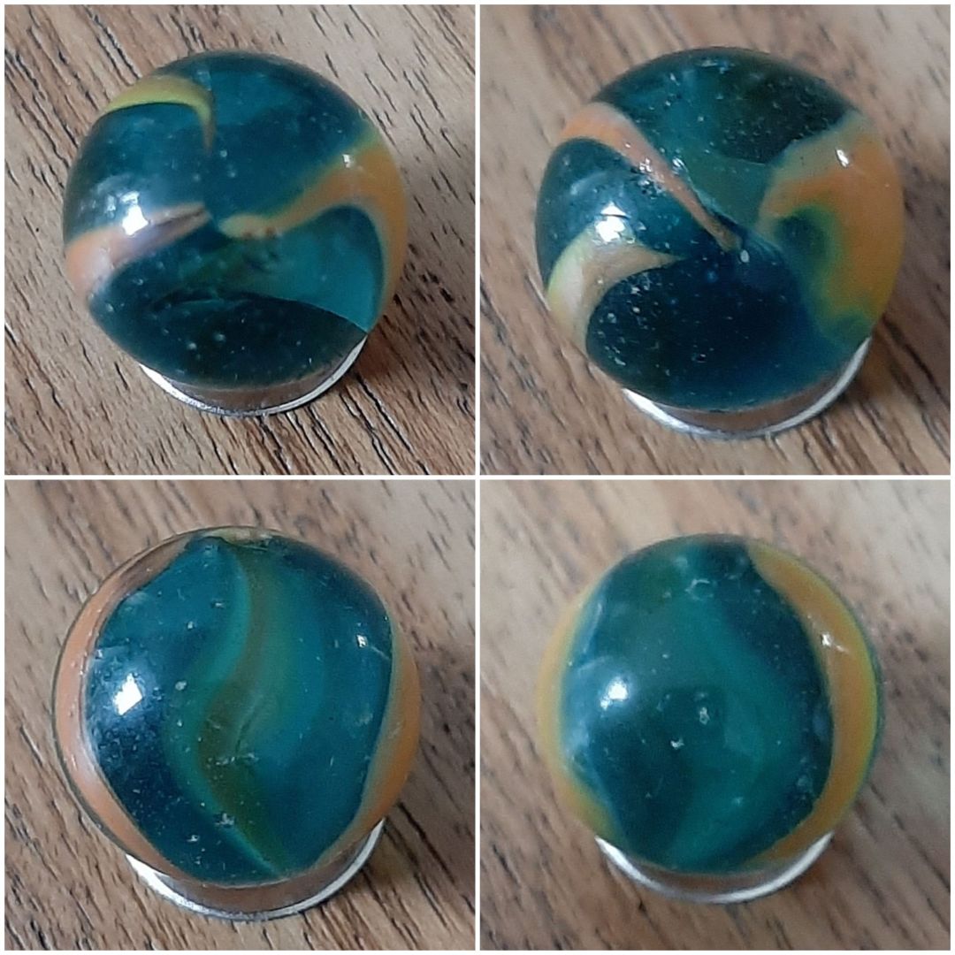 Something is lurking inside , some kind of catseye ? - Marble I.D.'s ...