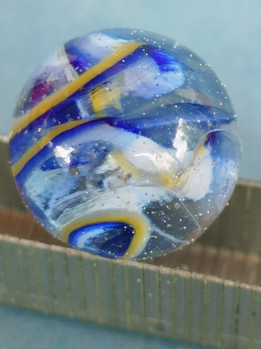 Is this a Christiansen marble....gone bananas looking at so much in ...